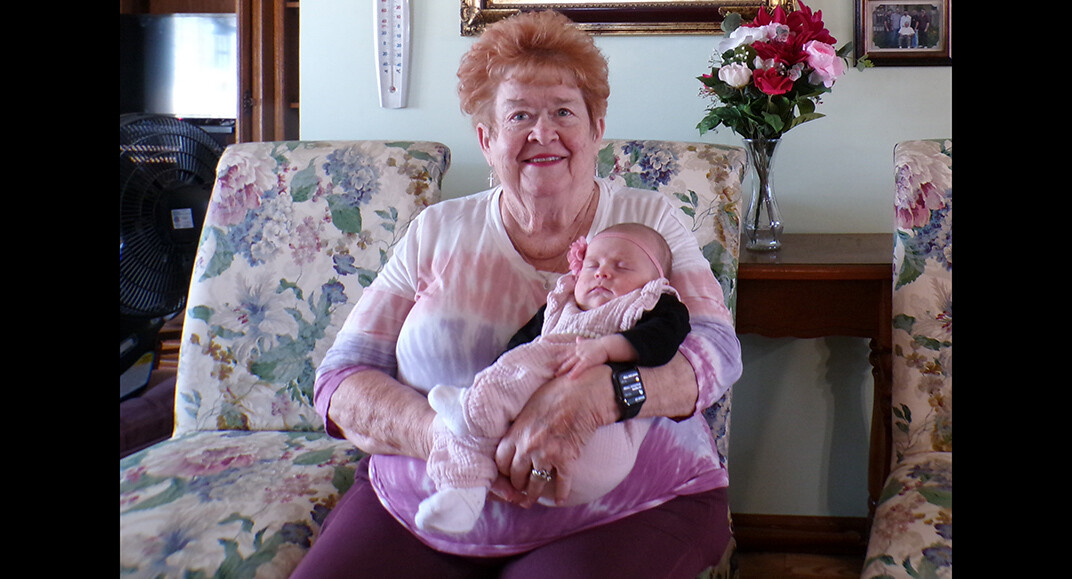 Johnson holds 100th grandchild on her lap | The Berne Witness